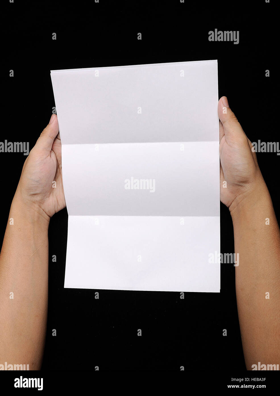 Male hand holding folded blank A4 copy space letter Stock Photo - Alamy