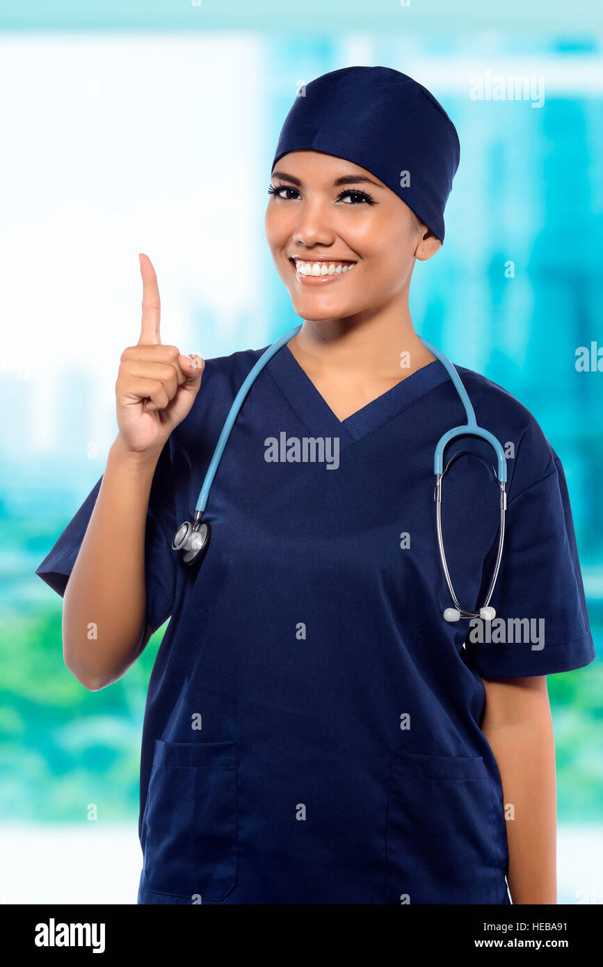 Medical surgeon in uniform with hospital background Stock Photo - Alamy