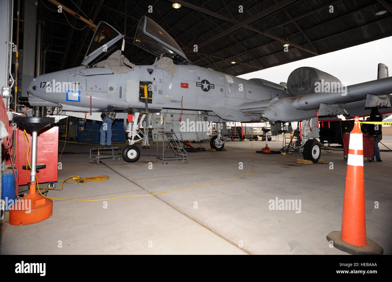 An A-10A Thunderbolt sits under a maintenance hangar on Davis-Monthan ...