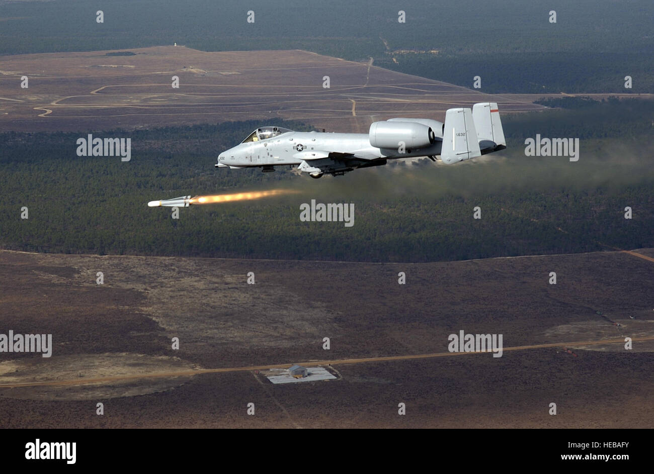 An AGM-65 Maverick missile flies away from a US Air Force (USAF) A-10 ...