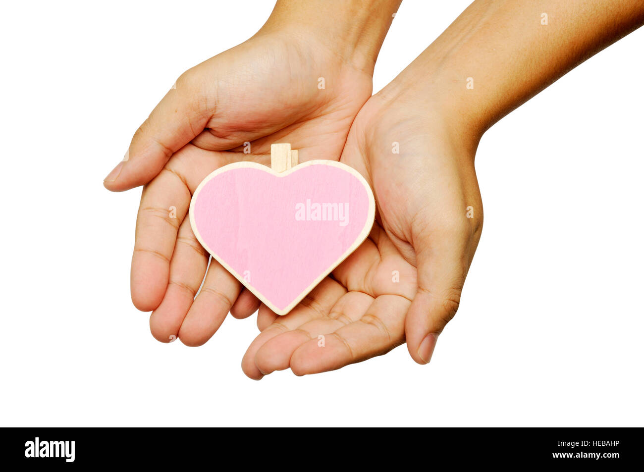 Human hand holding heart shape wooden sign isolated over white ...