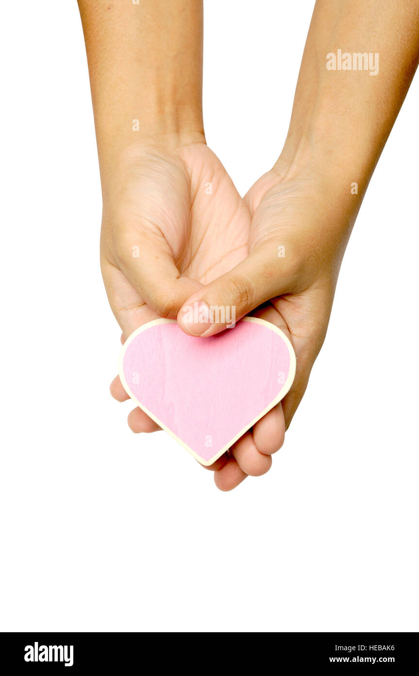 Human hand holding heart shape wooden sign isolated over white ...