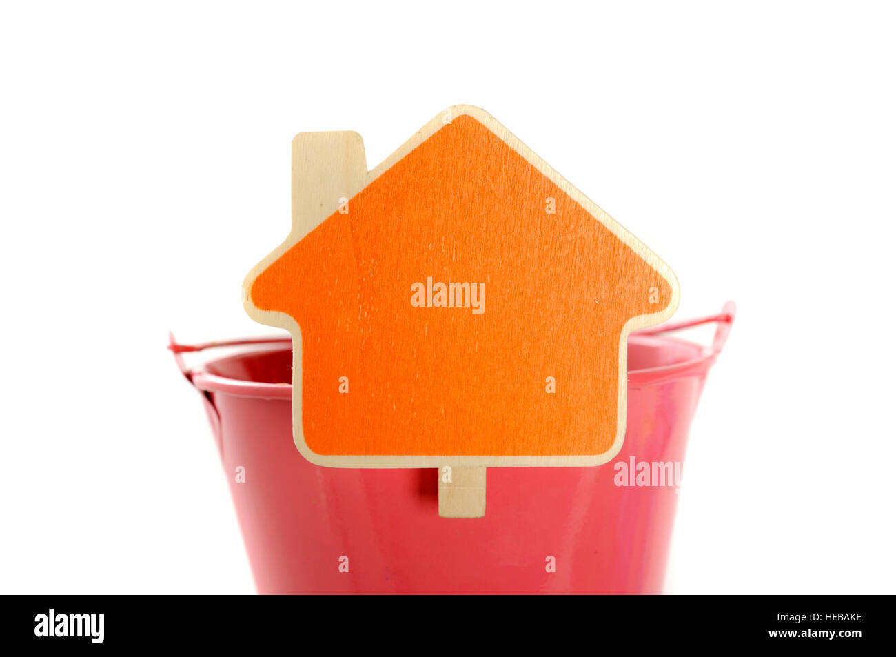House shape sign made from wood on red metal bucket. You can put your ...