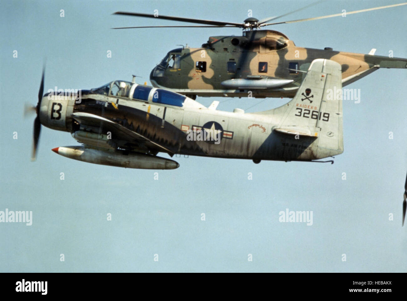 A1/A-1E/pho 115 K 19547 - An A-1E Skyraider escorts an HH-3C rescue ...