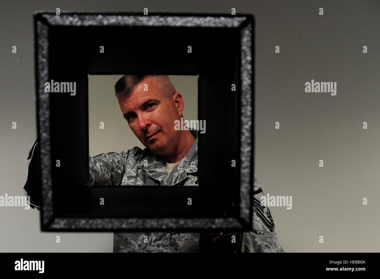 Master Sgt. Perry Woods demonstrates one of his magic tricks at Joint ...