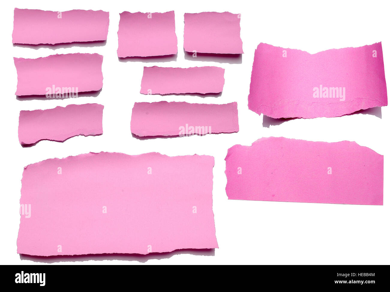 Collection of pink paper tears, isolated on white with soft shadows ...