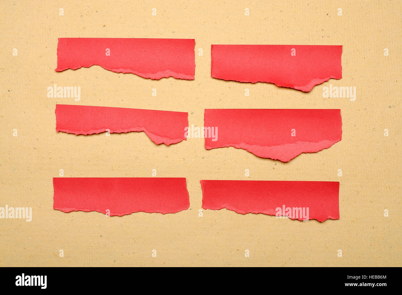 Collection of red paper tears, shot on brown background Stock Photo - Alamy