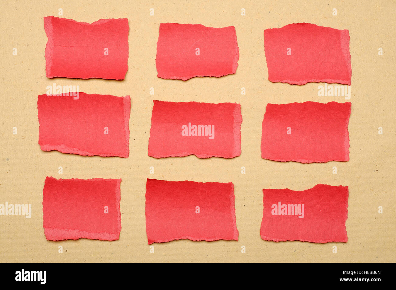Collection of red paper tears, shot on brown background Stock Photo - Alamy