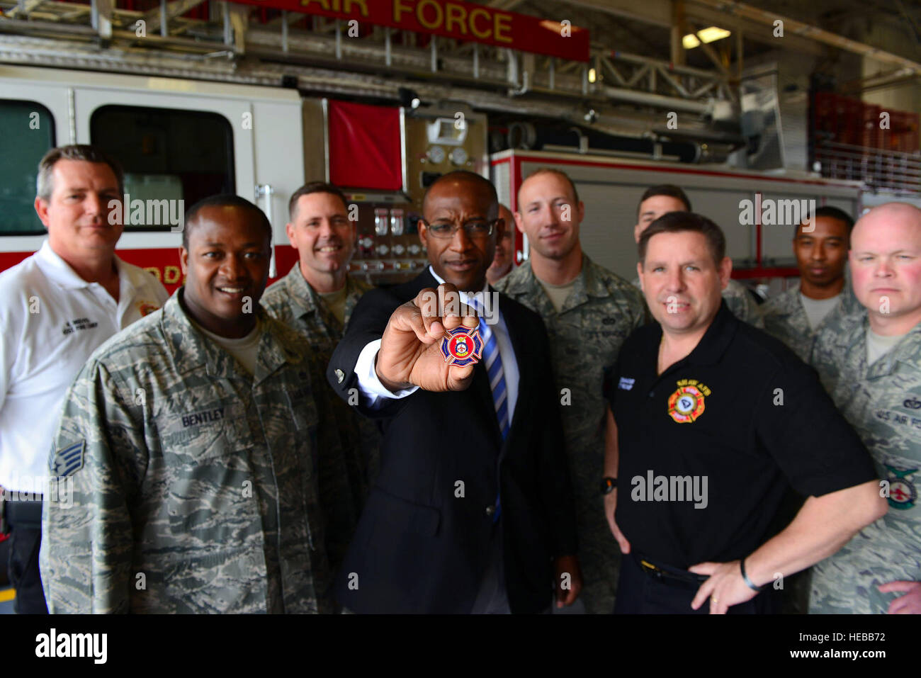 U.S. Marine Corps retired Capt. Ken Bevel presents his coin after being ...