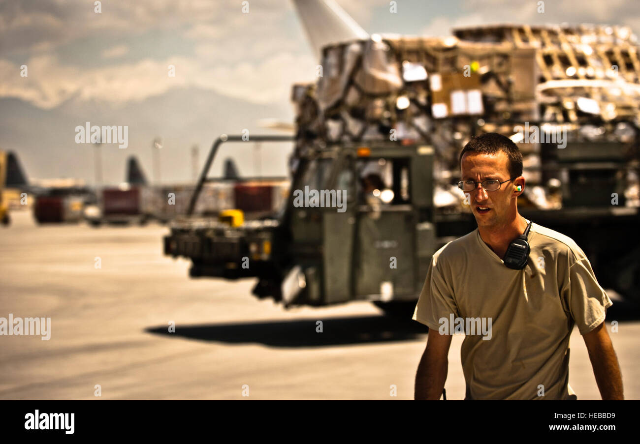 Tech. Sgt. Randy Owens, Ramp Services Load Team chief, coordinates a ...