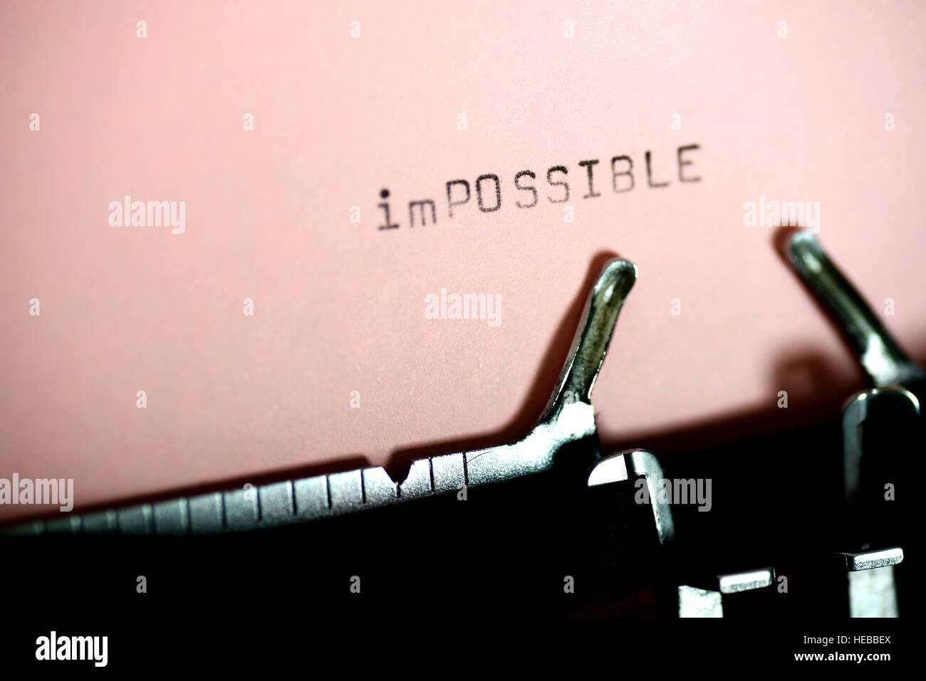 imPossible typing type on purple paper on typewriter Stock Photo - Alamy