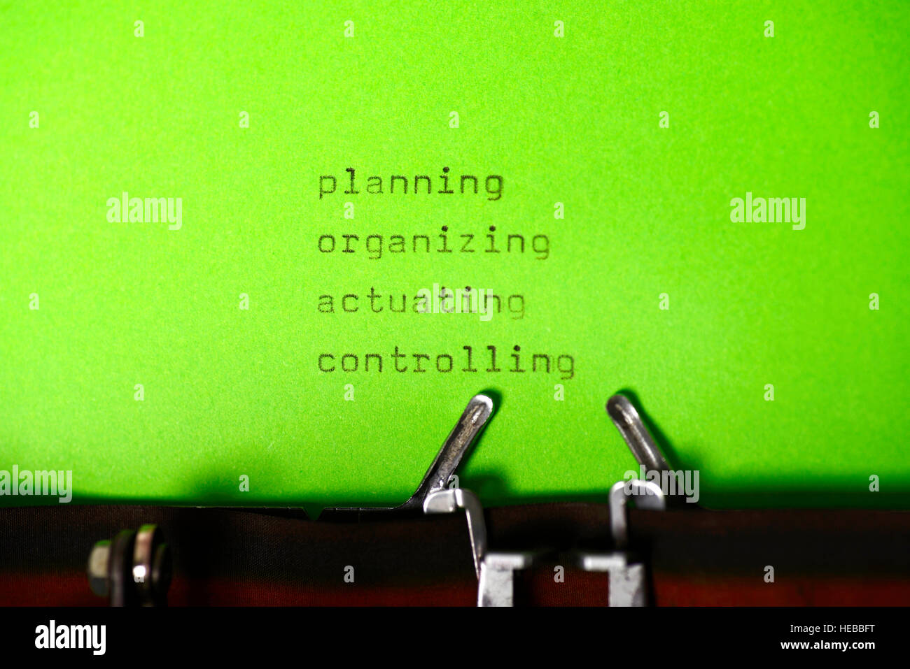 POAC type on typewriter with green paper background Stock Photo - Alamy