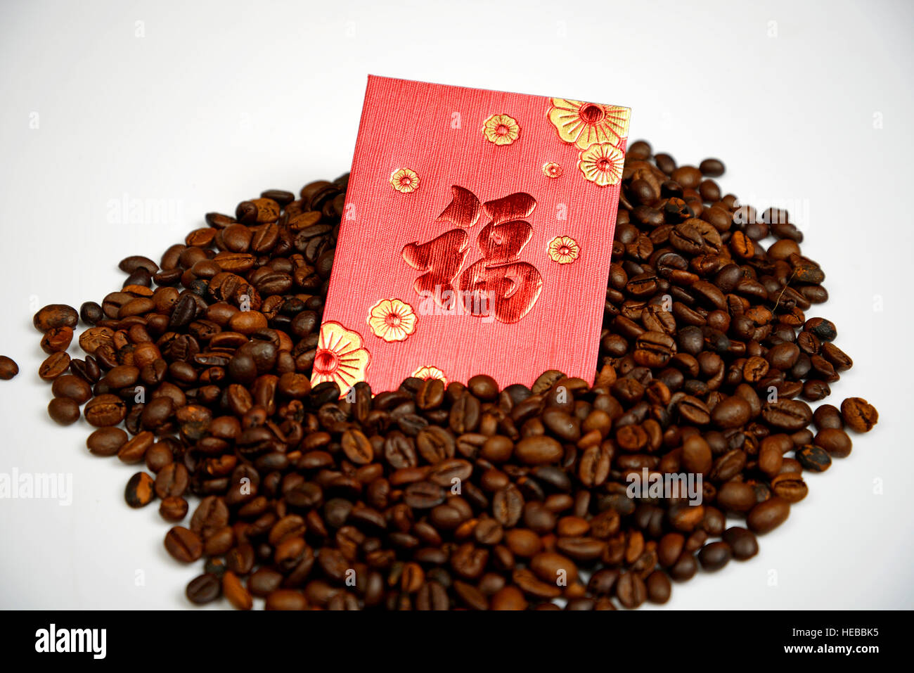 Chinese ang pao and coffee bean isolated over white background Stock ...