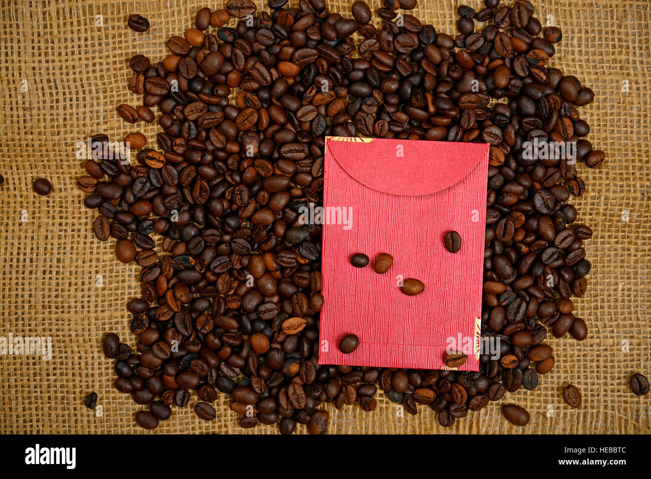 Chinese ang pao and coffee bean over burlap background Stock Photo - Alamy