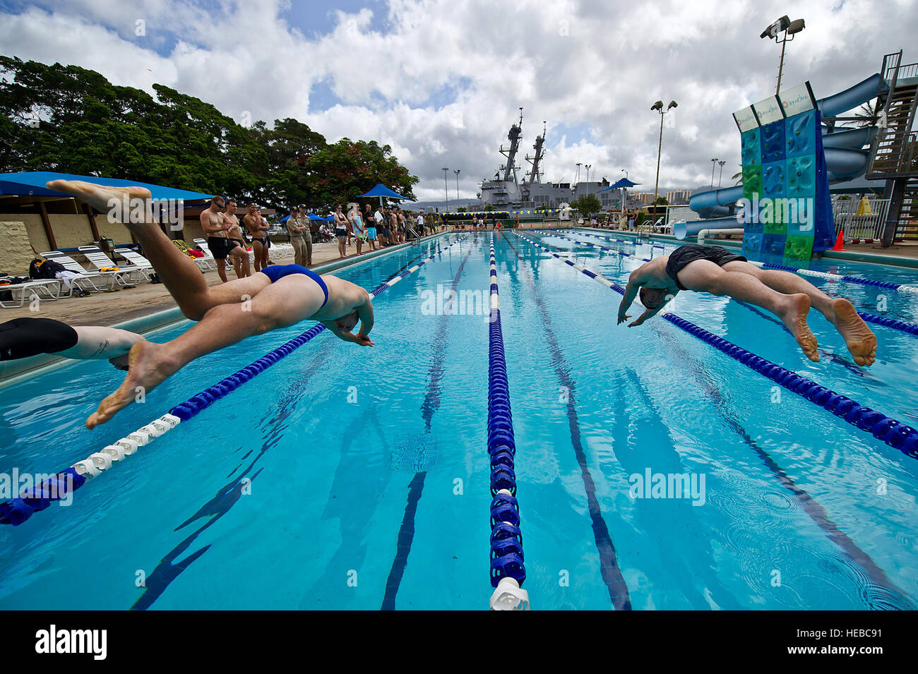 Sailors from the U.S. Navy the Royal Australian navy dive into the pool ...