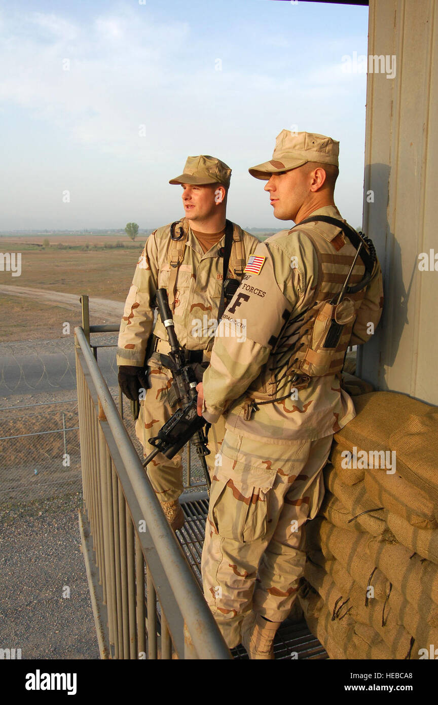 Staff Sgt. David Hoy and Senior Airman Jacob Medina survey the ...
