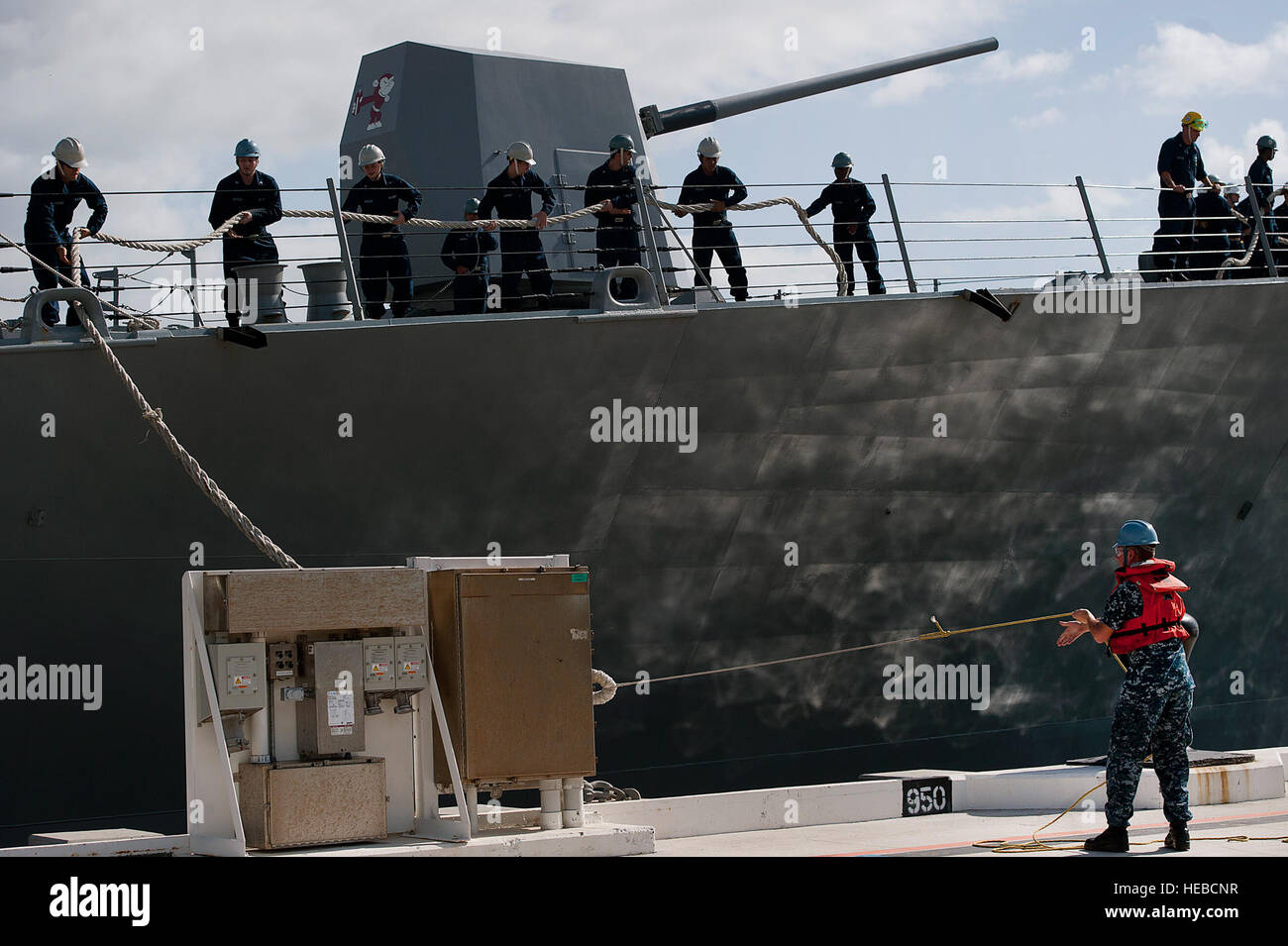 A U.S. Navy Sailor helps secure the U.S. Navy USS Michael Murphy, a ...