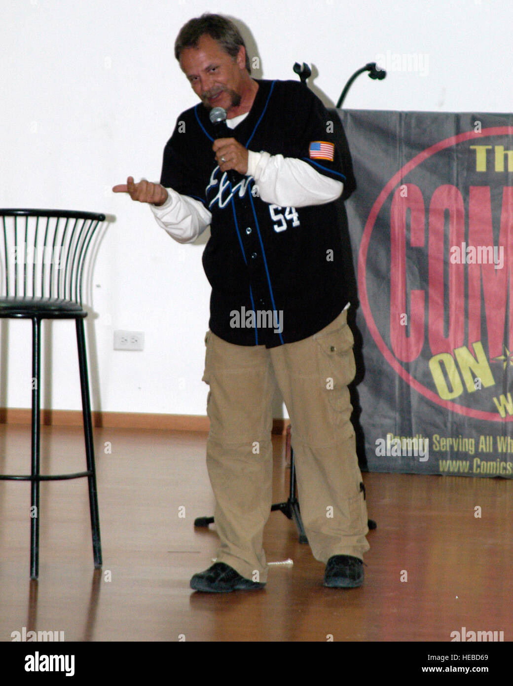 SOUTHWEST ASIA -- Comedian Tom Foss performs his stand-up routine at ...