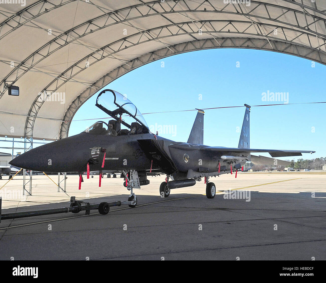 An F-15E Strike Eagle prepares to cut a ribbon on the grand opening of ...