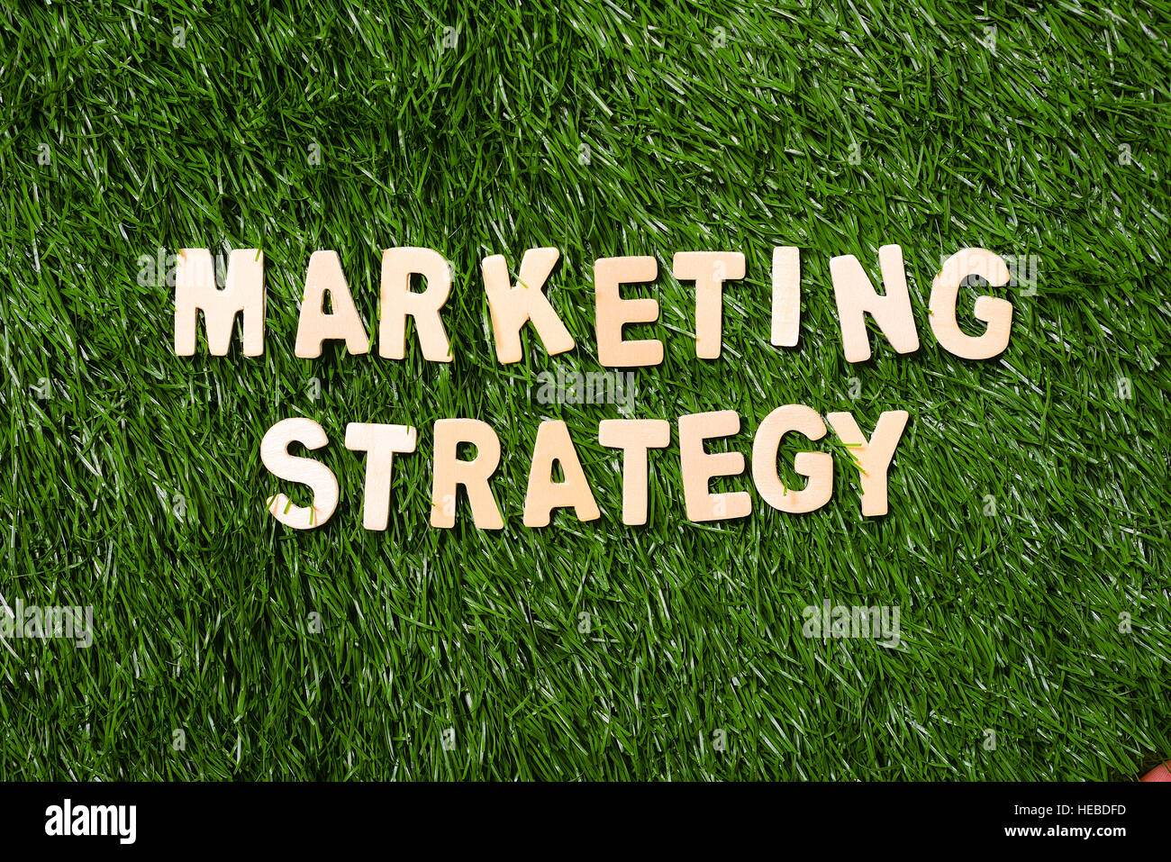 Marketing strategy wooden sign on green grass background Stock Photo ...