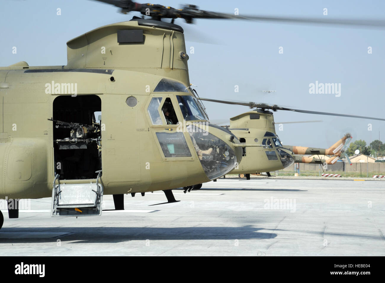 Two U.S. Army CH-47 Chinook helicopters get ready for takeoff from ...