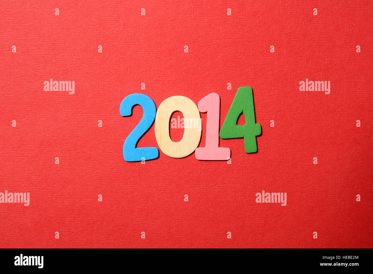 2014 text on red paper background Stock Photo - Alamy