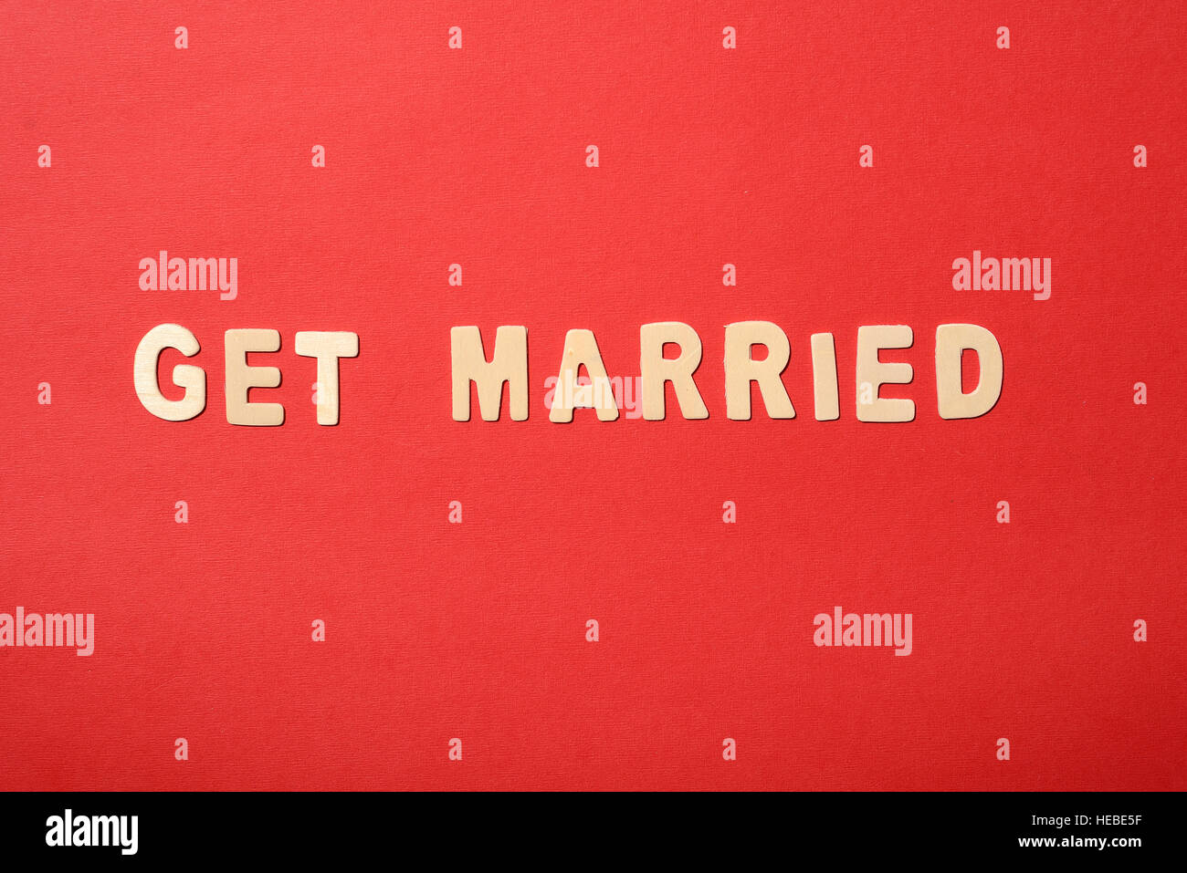 Get married text on red paper background Stock Photo - Alamy