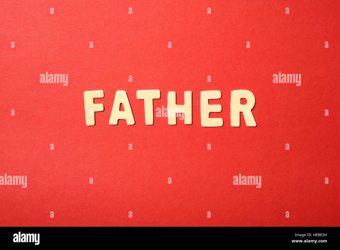 Father text on red paper background Stock Photo - Alamy