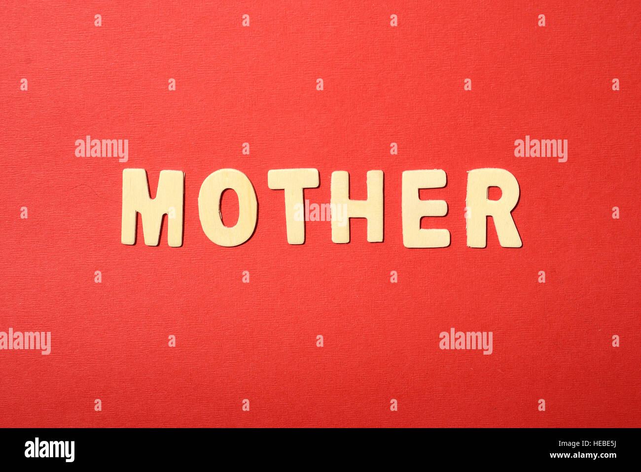 Mother text on red paper background Stock Photo - Alamy