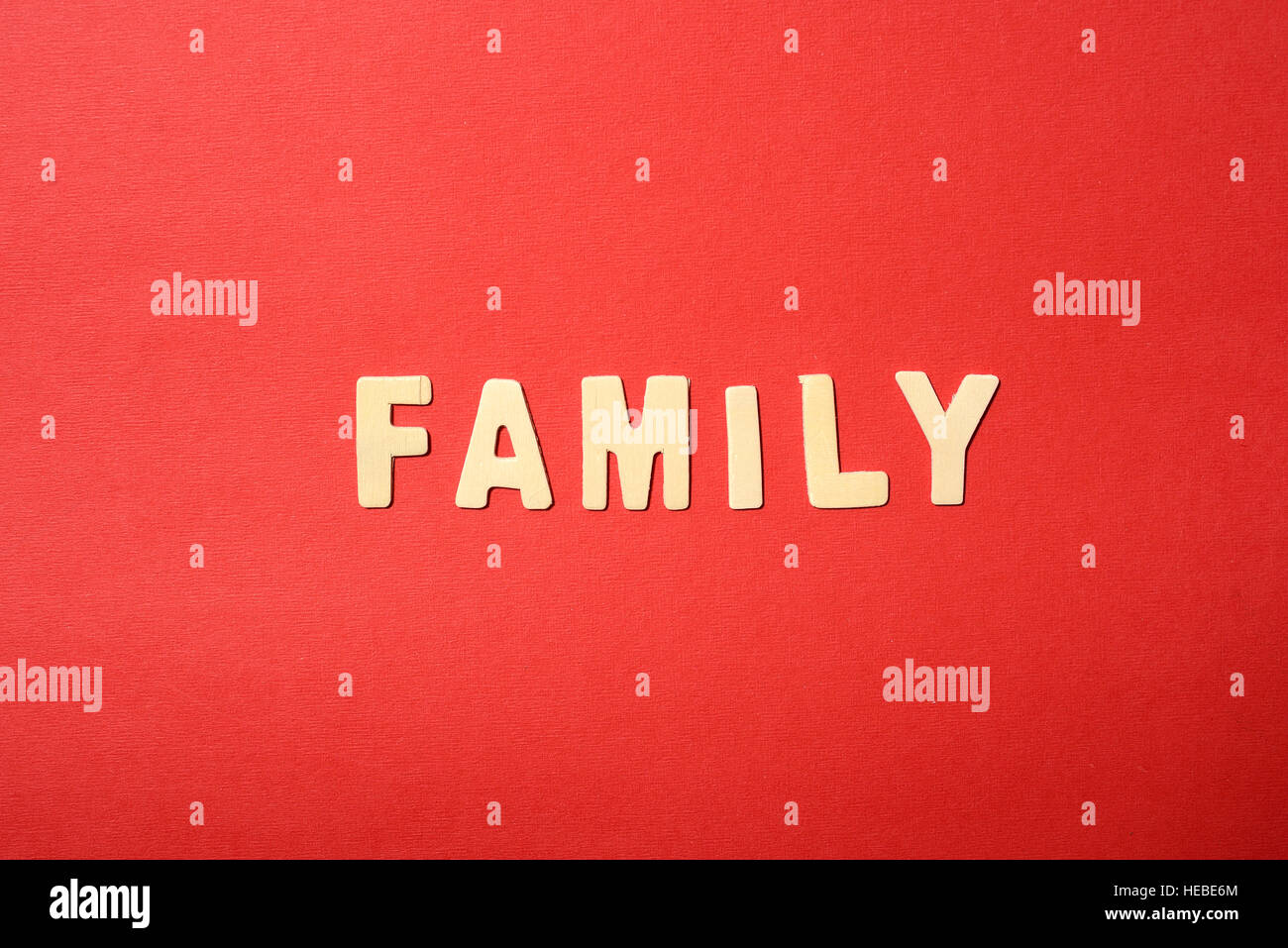 Family text on red paper background Stock Photo - Alamy