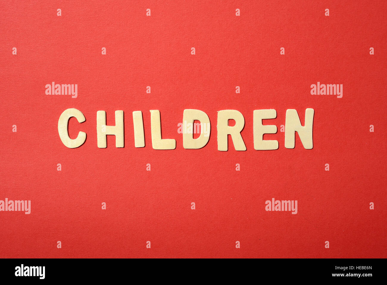 Children text on red paper background Stock Photo - Alamy