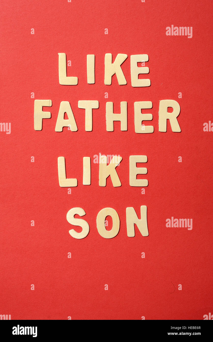 Like father like son text on red paper background Stock Photo - Alamy