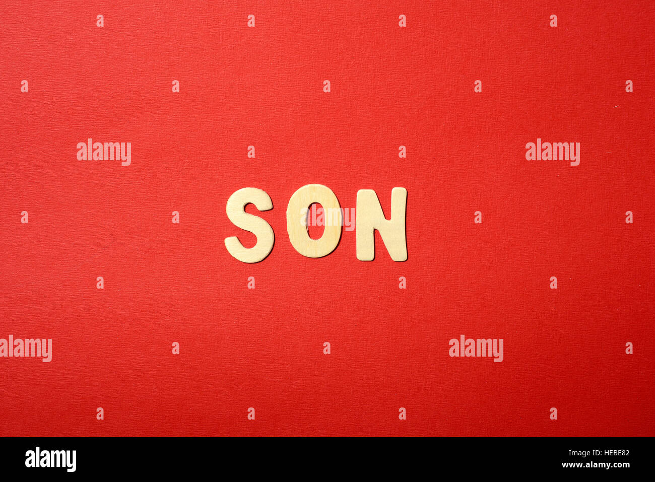 Son text on red paper background Stock Photo - Alamy