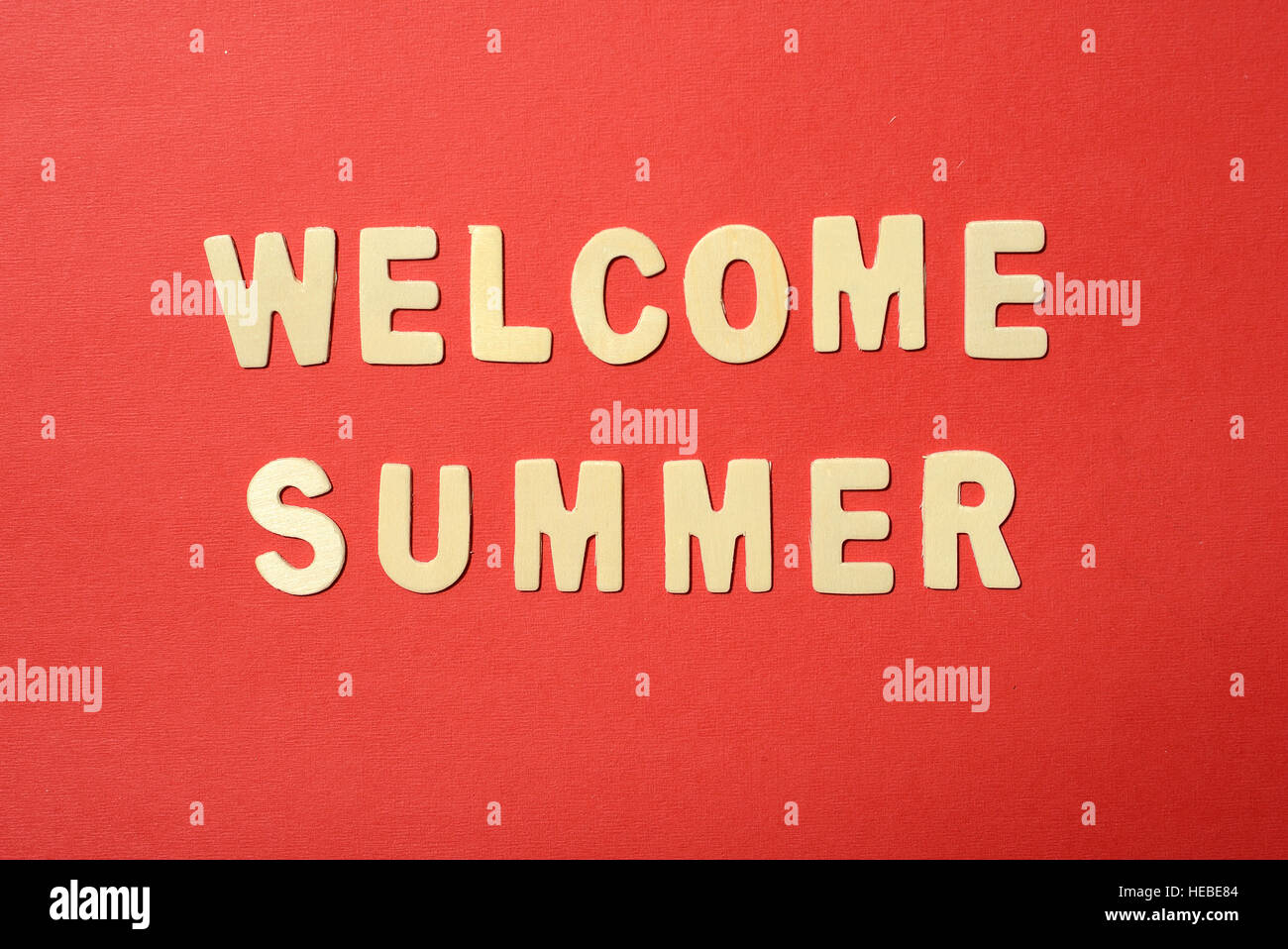 Welcome summer text on red paper background Stock Photo - Alamy