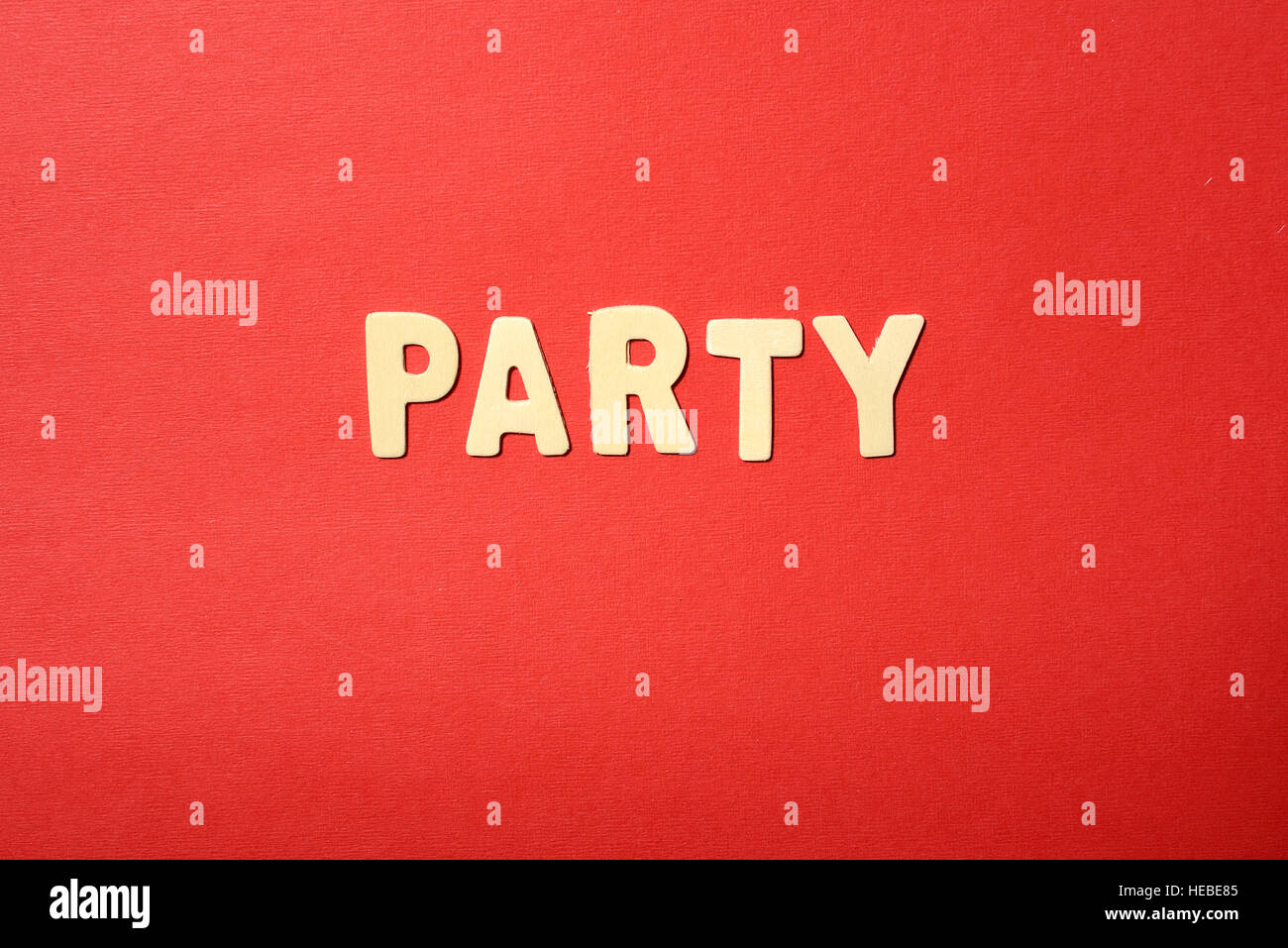 Party text on red paper background Stock Photo - Alamy