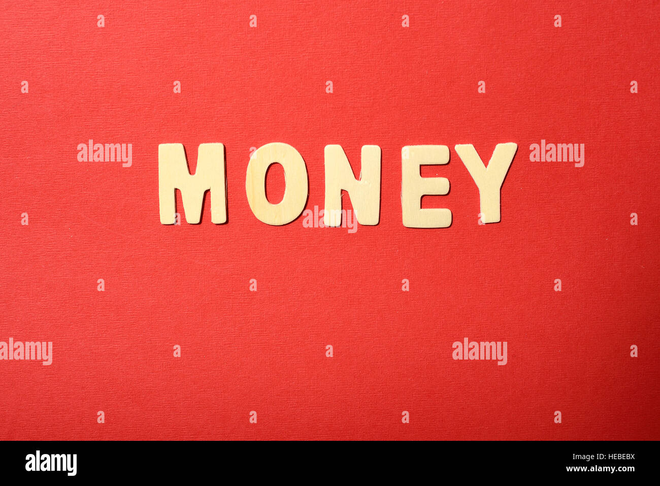 Money text on red paper background Stock Photo - Alamy