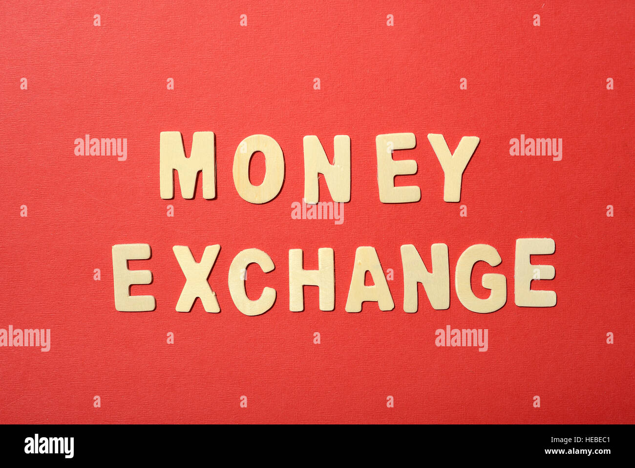 Money exchange text on red paper background Stock Photo - Alamy