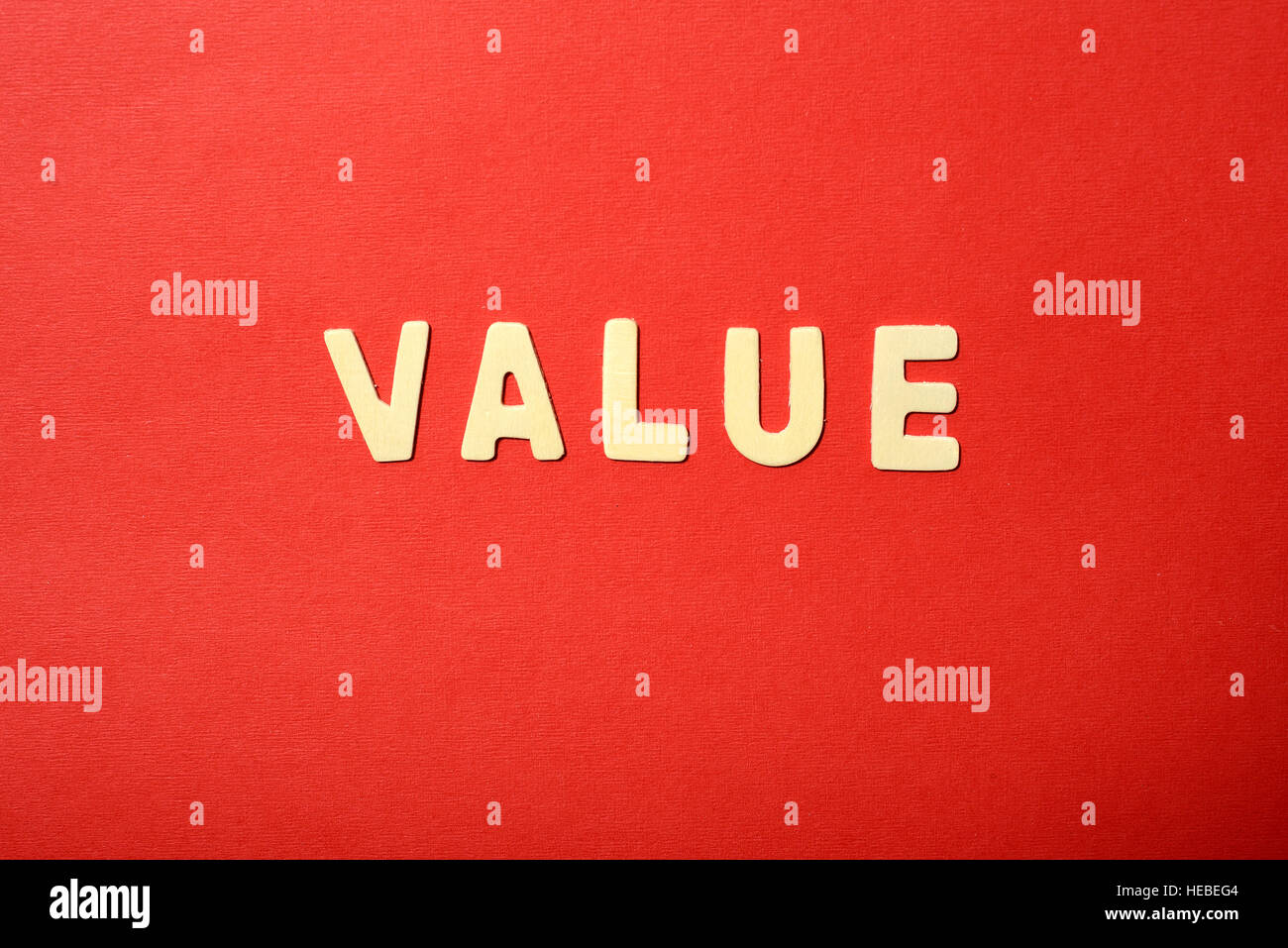 Value text on red paper background Stock Photo - Alamy