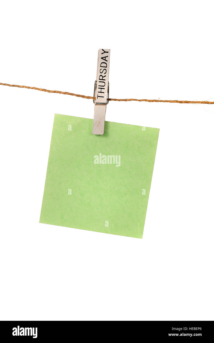 Color memo hanging with thursday cloths pin isolated over white ...