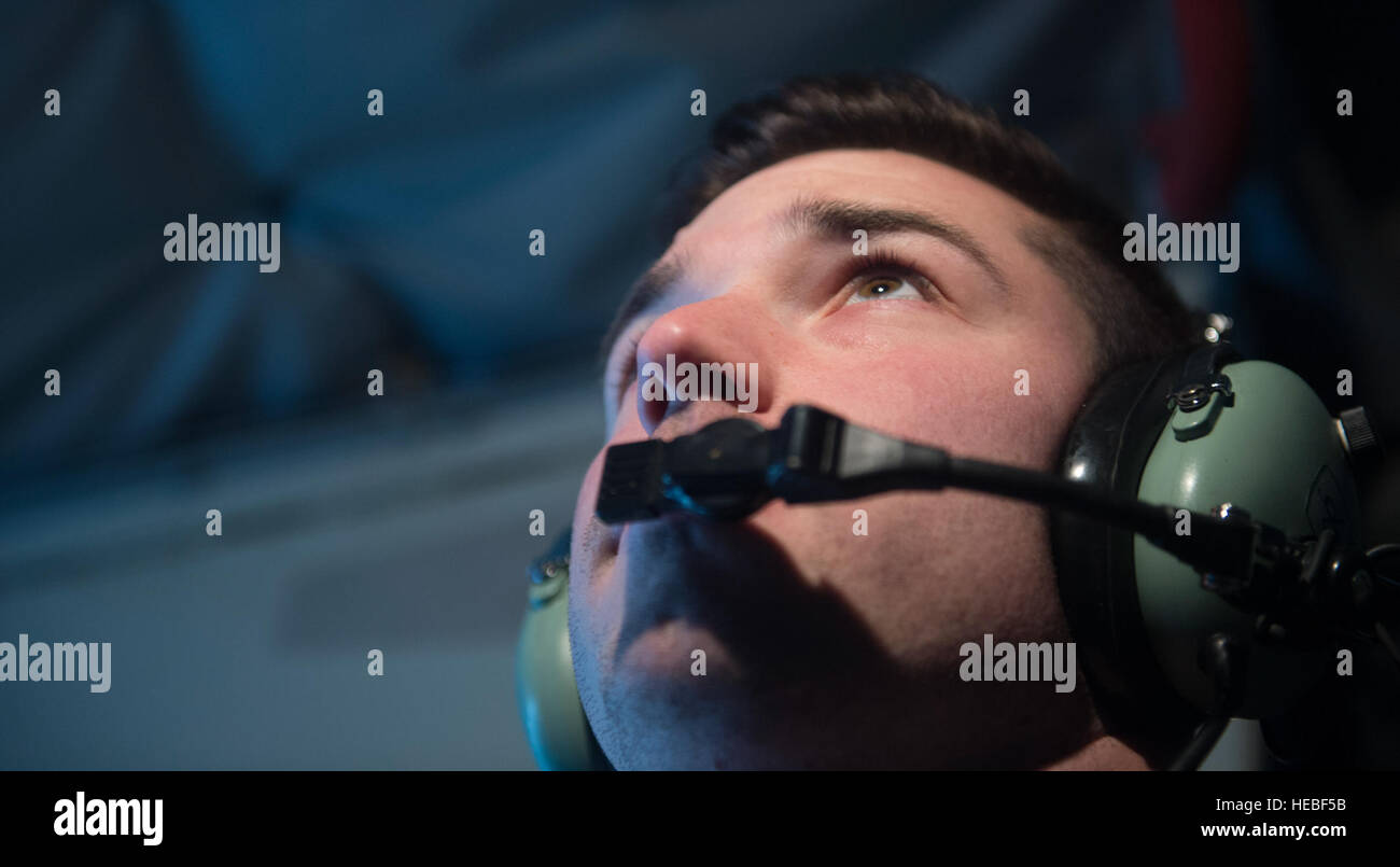 A KC-135 Stratotanker boom operator monitors flight instruments after ...
