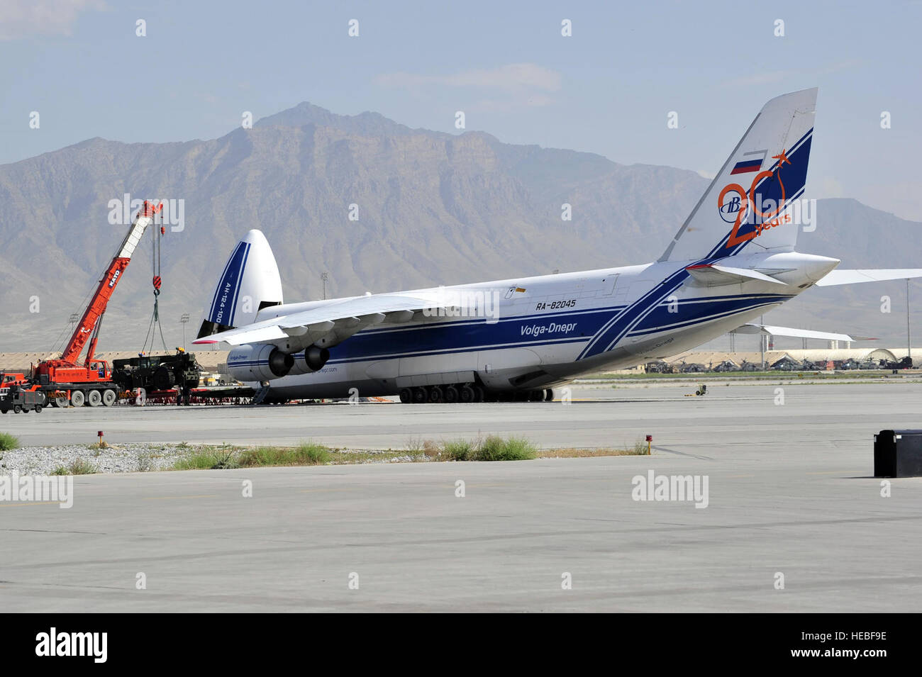 Contractors unload a rough terrain container handler from an Antonov AN ...