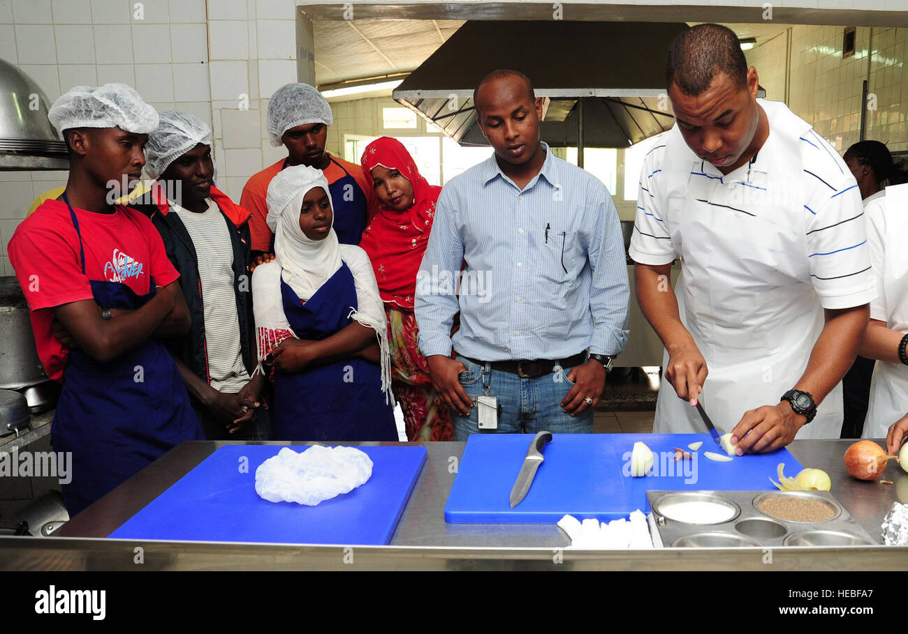 U.S. Navy Petty Officer 1st Class Christopher Radcliffe (right ...