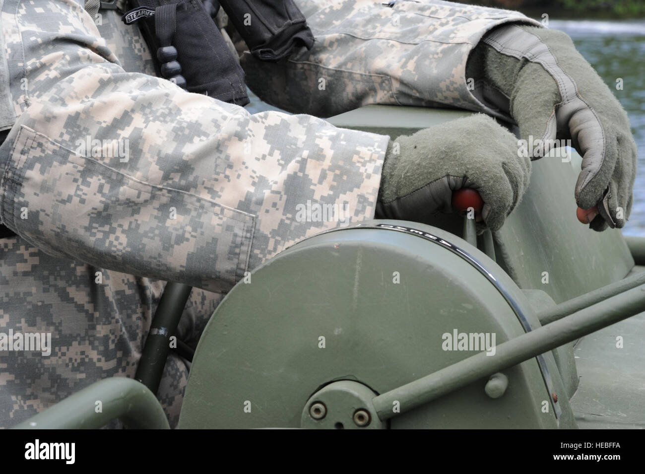 U.S. Army engineers operate a Mark II Bridge Erecting Boat to transport ...