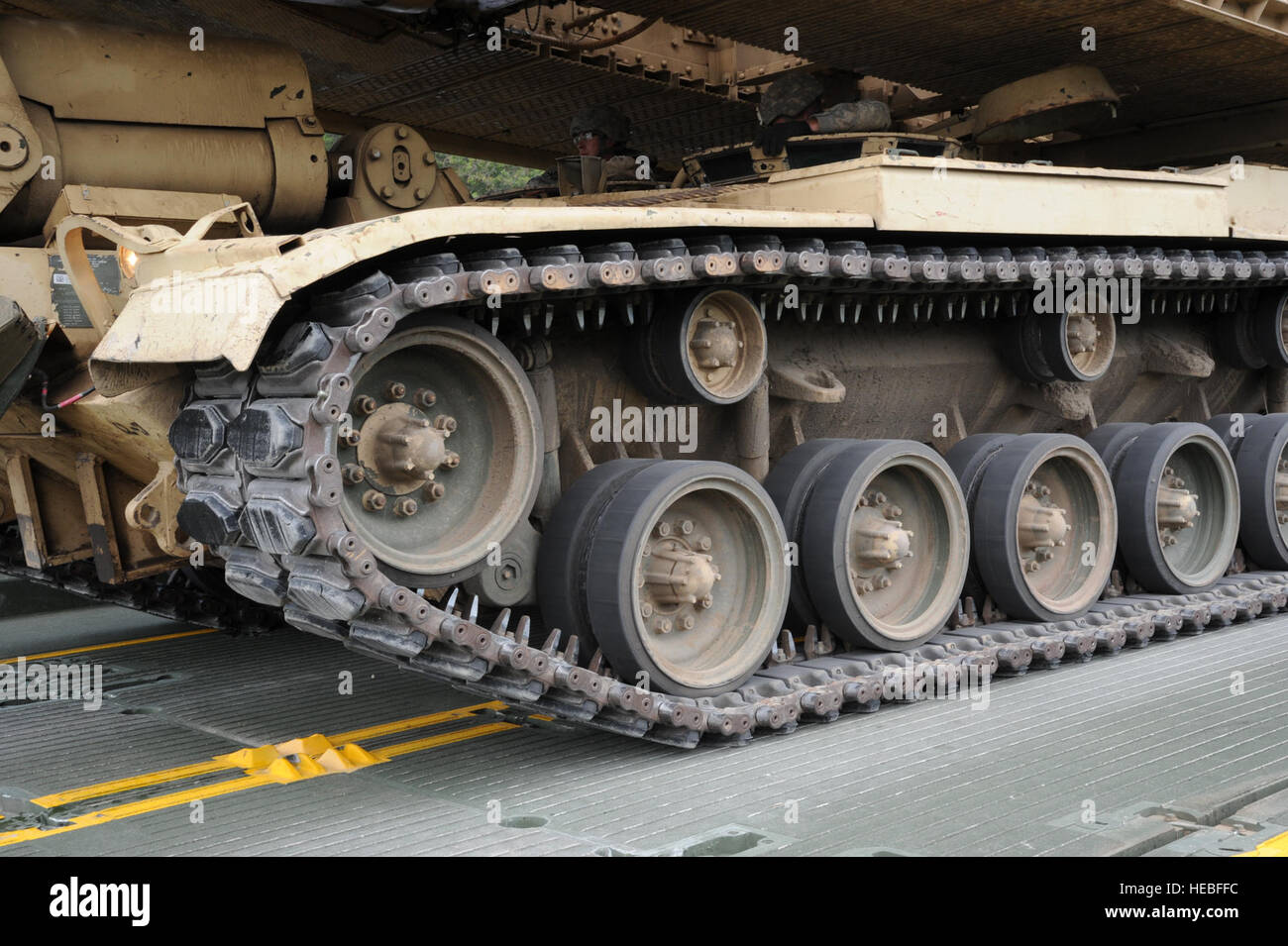 A U.S. Army Armored Vehicle Loaded Bridge is being transported by an ...