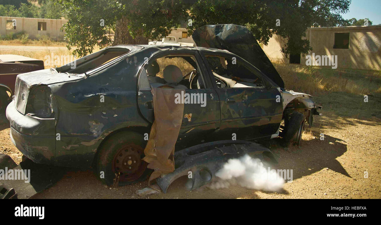 An improvised explosive device detonates while a convoy passes, during ...