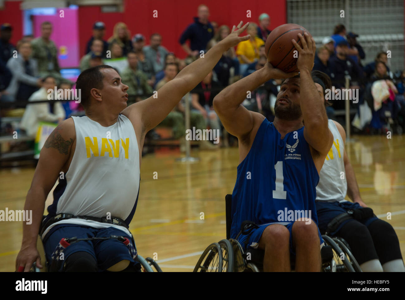U.S. Air Force athlete Ryan Pinney attempts a shot over Javier ...