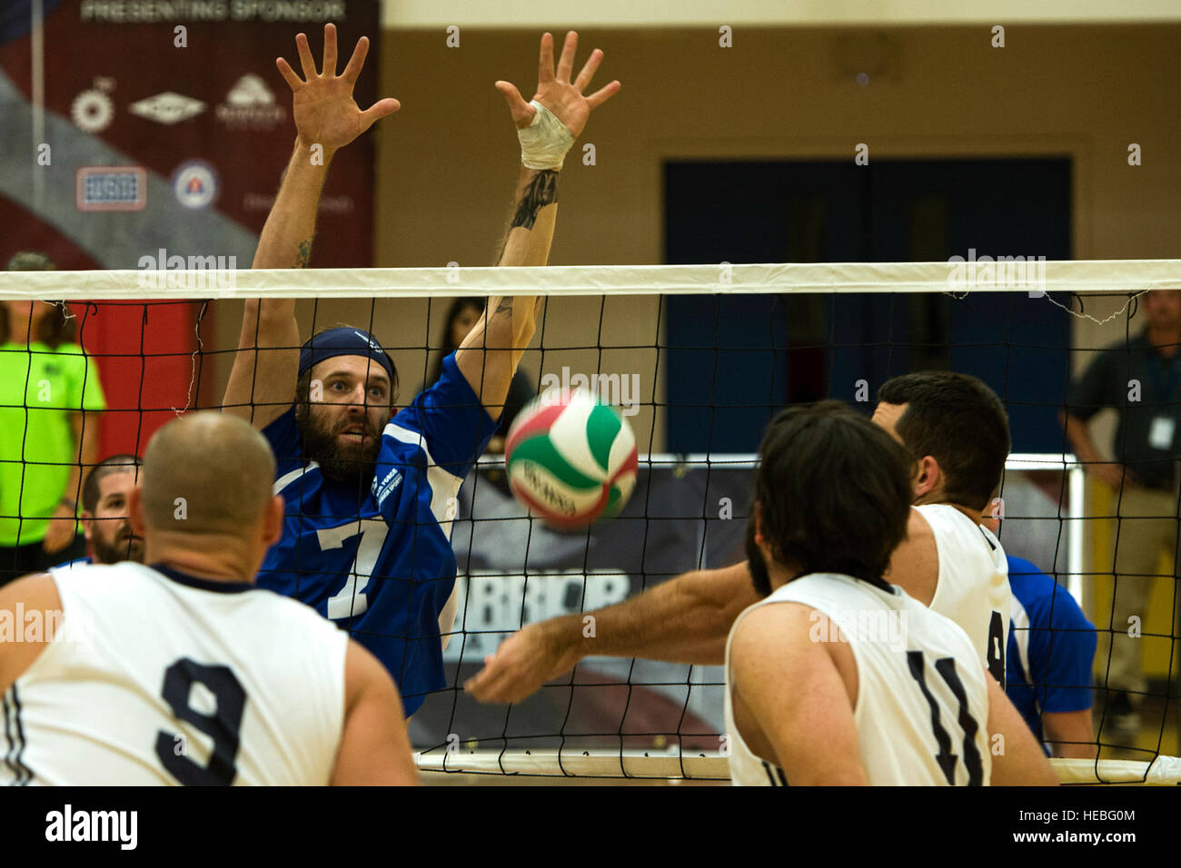 U.S. Air Force athlete Ryan Gallo participates in a sitting volleyball ...