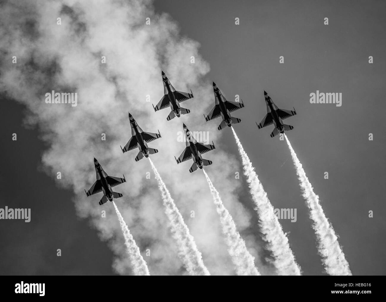 The U.S. Air Force Thunderbirds perform the Delta Loop aerial maneuver ...