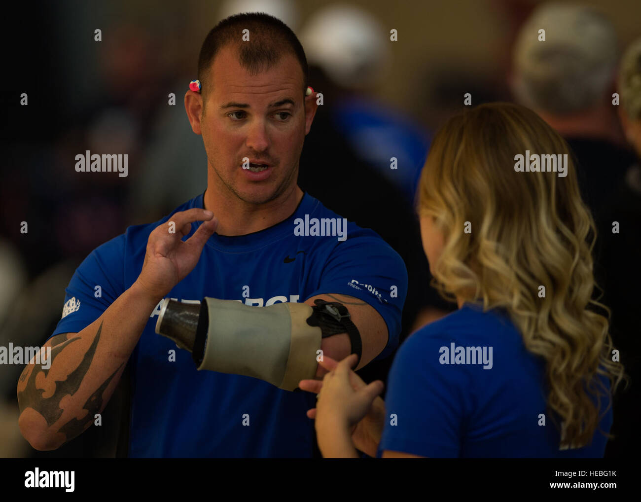 Air Force athlete Leonard Anderson speaks with his coach during the ...