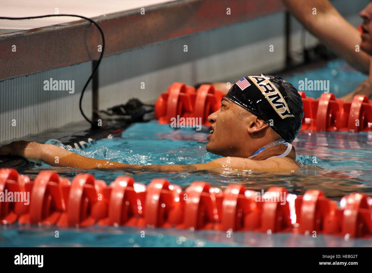 An Army Warrior Game athlete completes the swimming competition at the ...